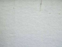 Muur met wit stucwerk - Fotobehang